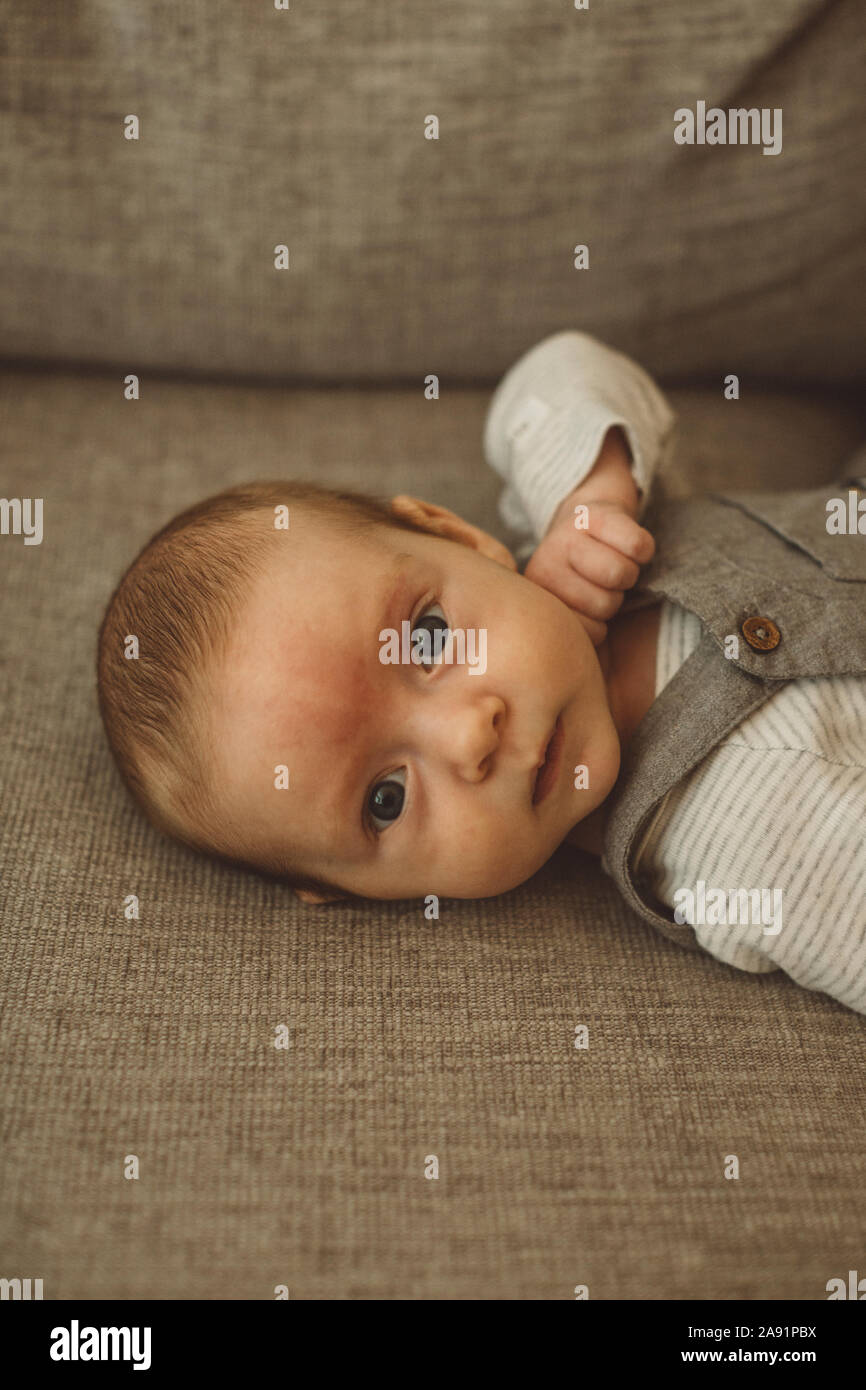 Baby looking at camera Stock Photo - Alamy