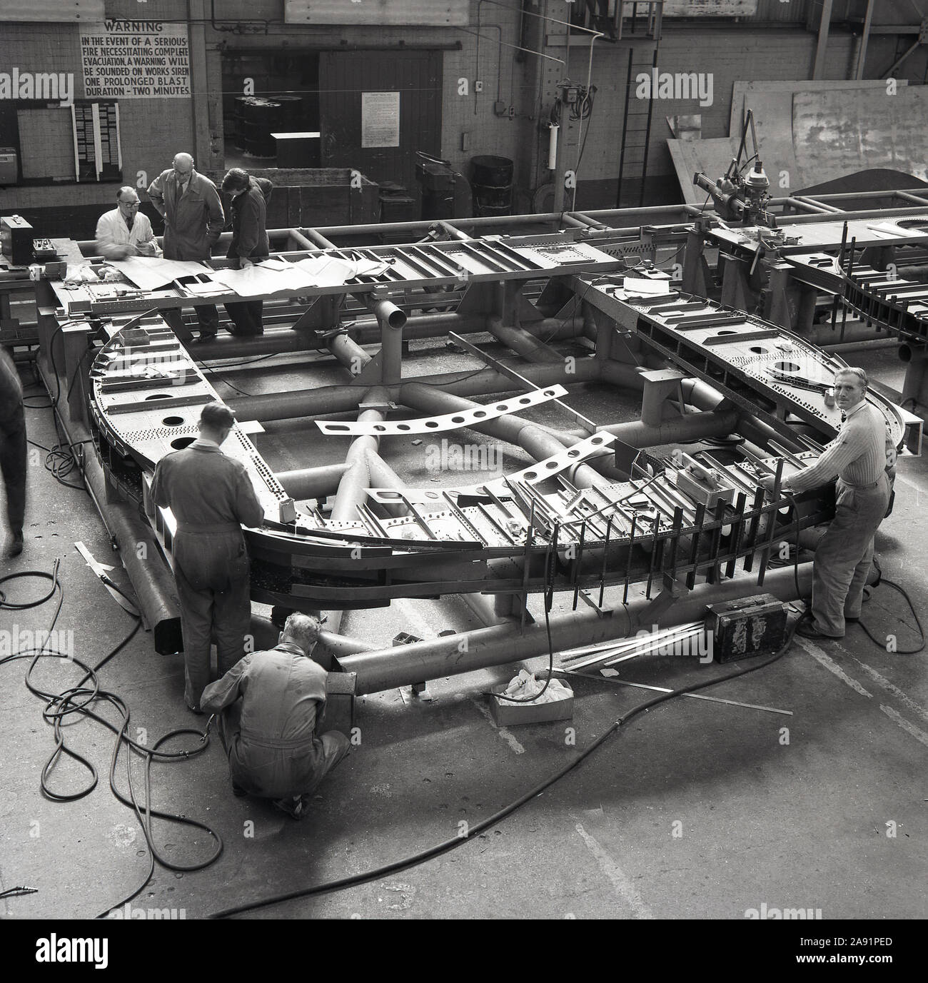 1950s, historical, aviation factory, workers making parts for aircraft ...