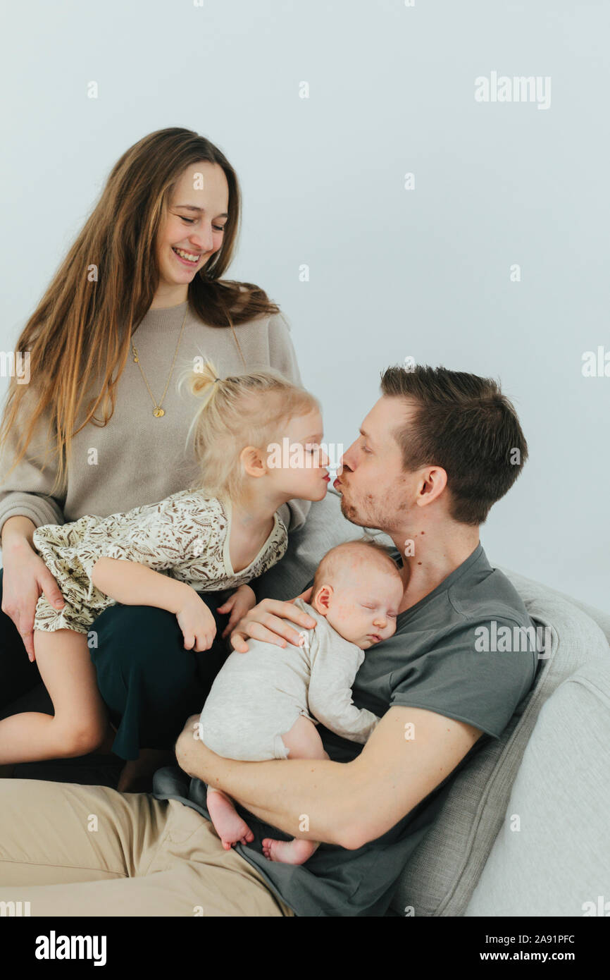 Parents with two children Stock Photo - Alamy