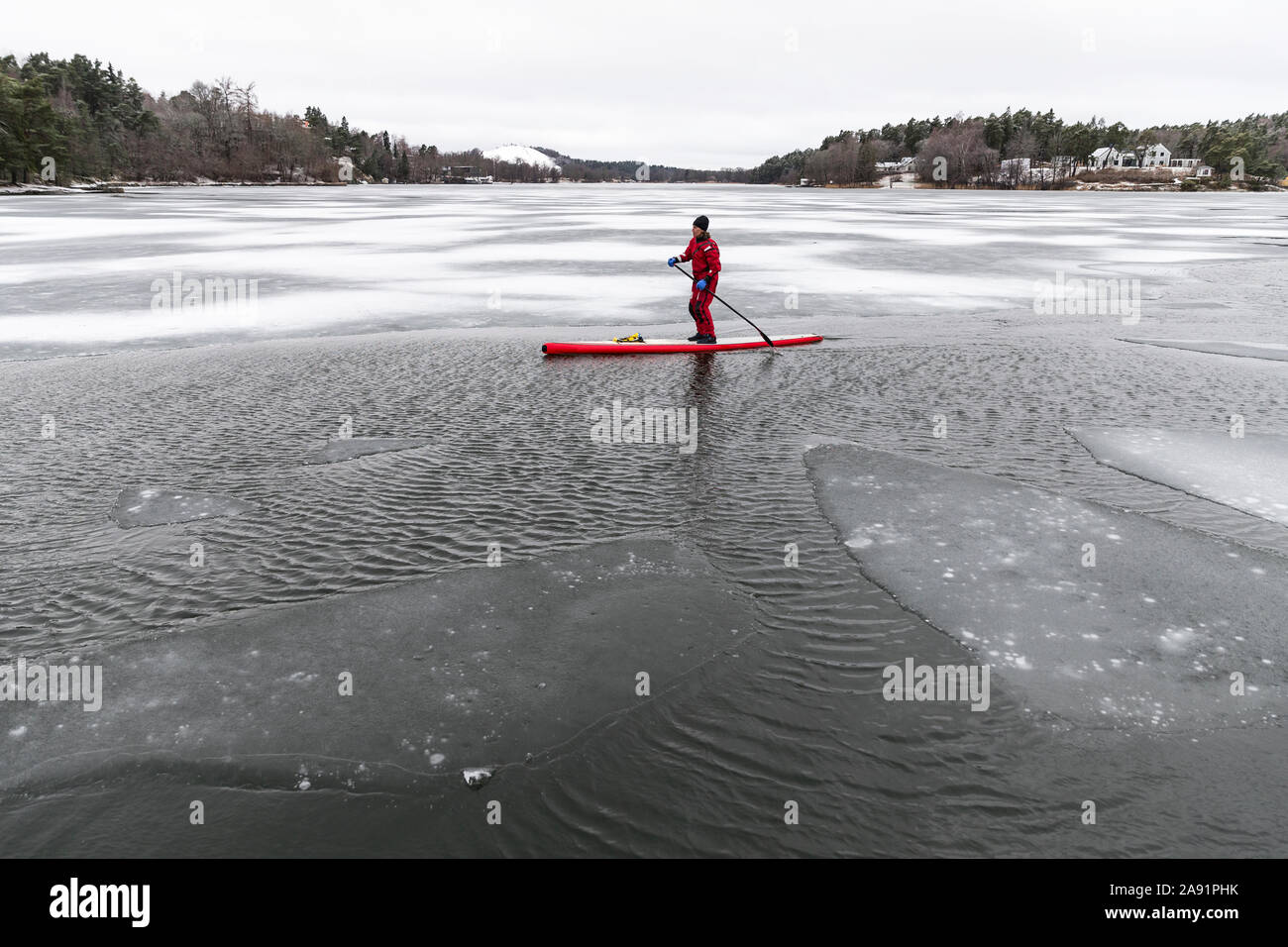 Person paddle boarding Stock Photo - Alamy