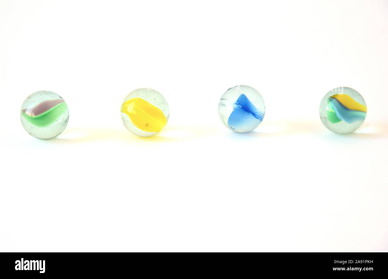 colorful glass balls in white background Stock Photo - Alamy