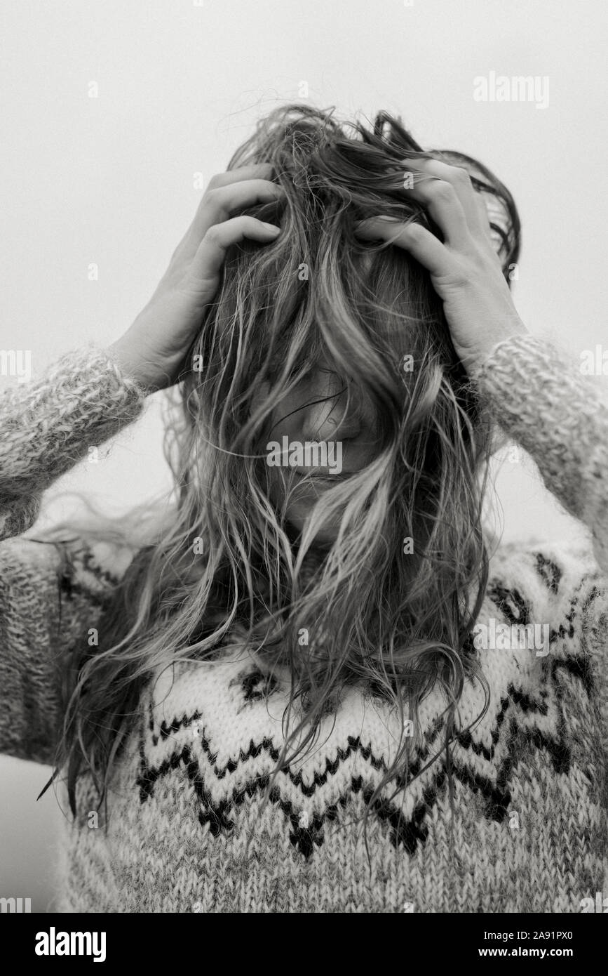 Woman with hair covering face Stock Photo - Alamy