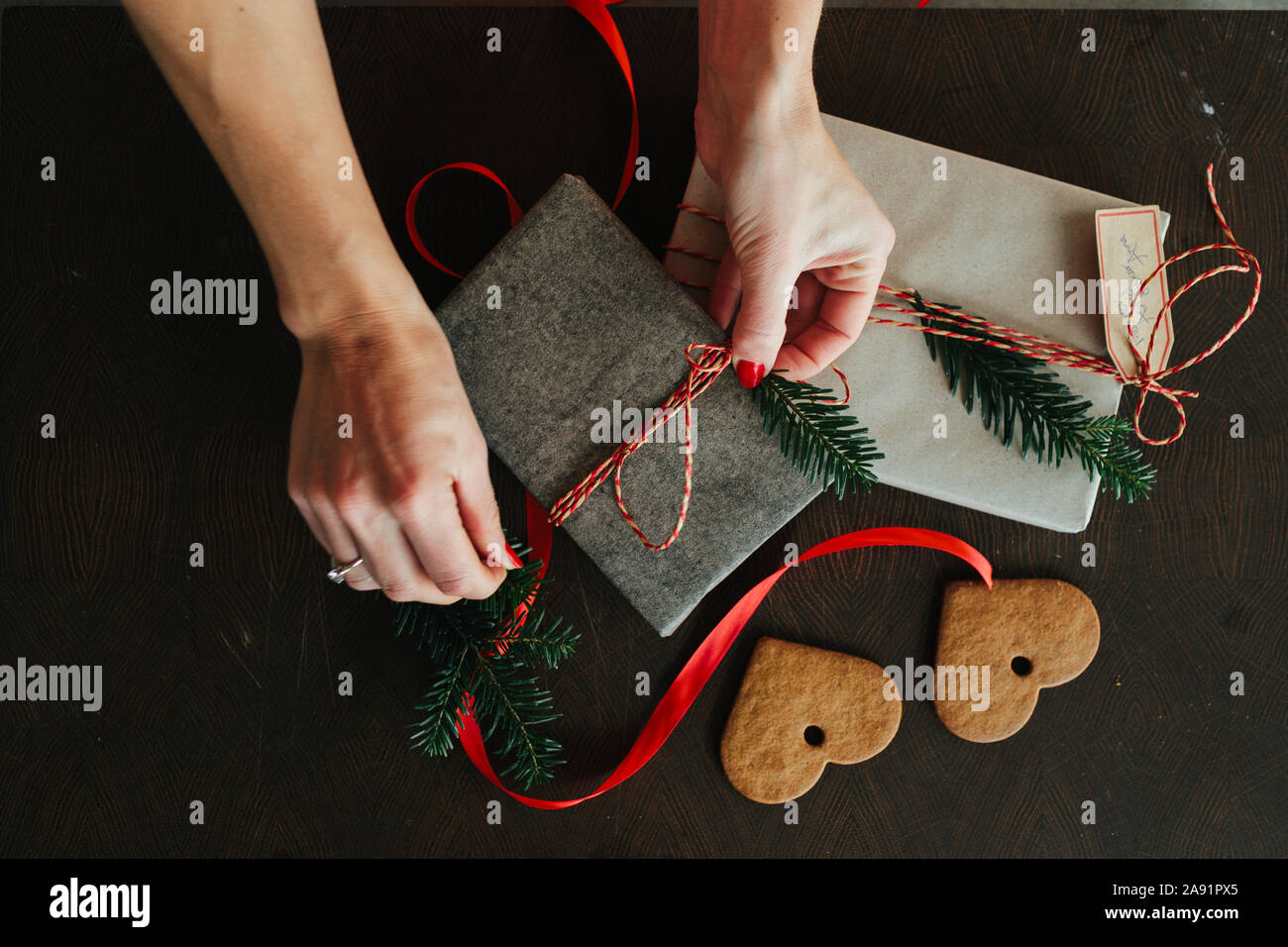 Packing Christmas present Stock Photo - Alamy