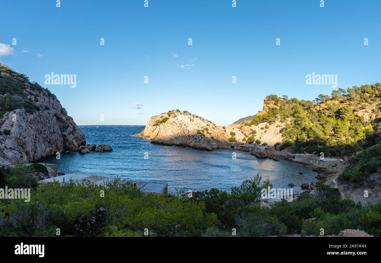 Turquoise waters in Es Portitxol, Ibiza, Spain. Hidden bay on the ...