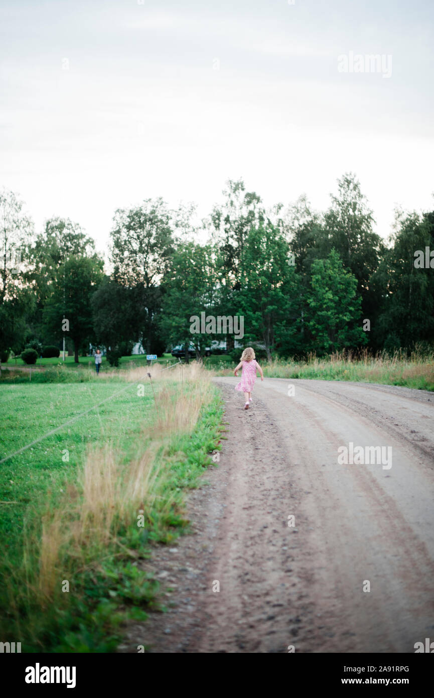 Girl running on dirt road hi-res stock photography and images - Alamy