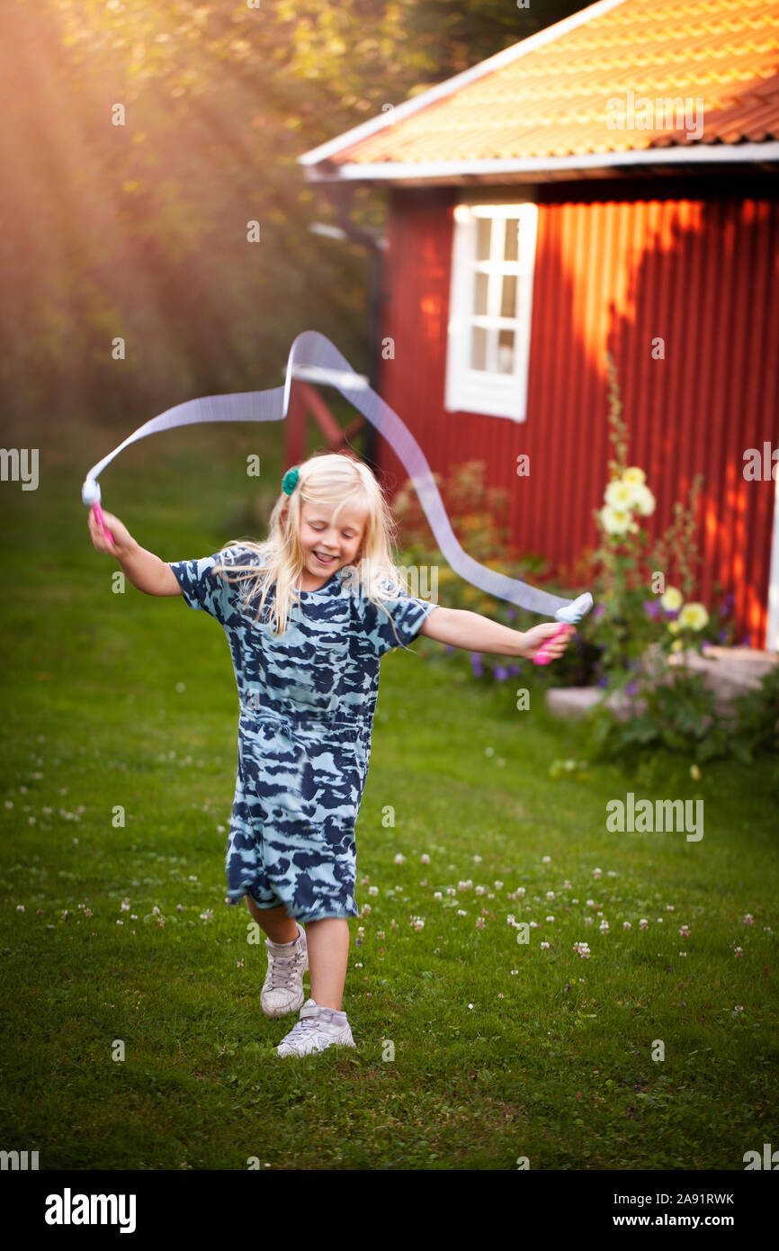 Red hair girl jumping the rope hi-res stock photography and images - Alamy
