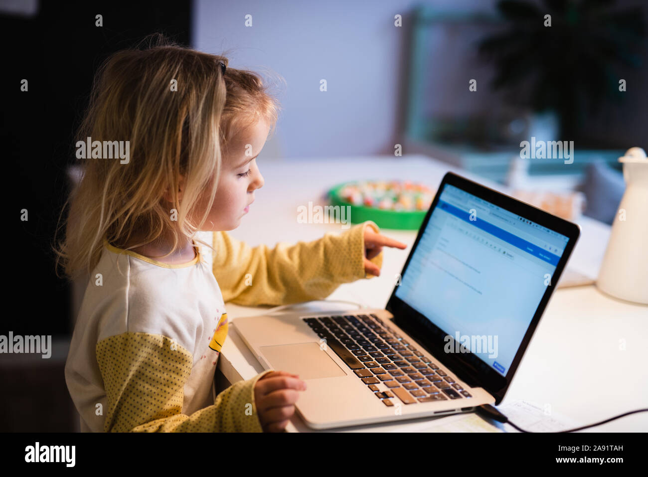 Girl using laptop Stock Photo - Alamy