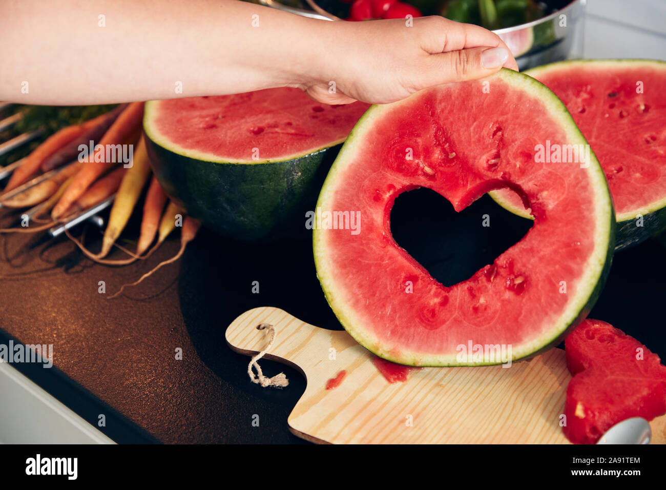 Hand holding watermelon slice Stock Photo - Alamy