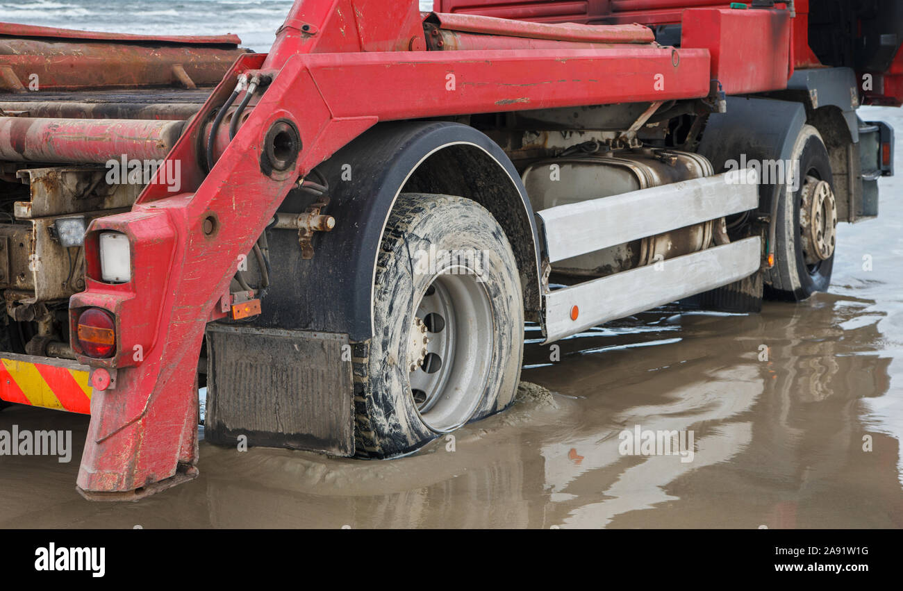 Heavy car sink into sand on coastline Stock Photo - Alamy