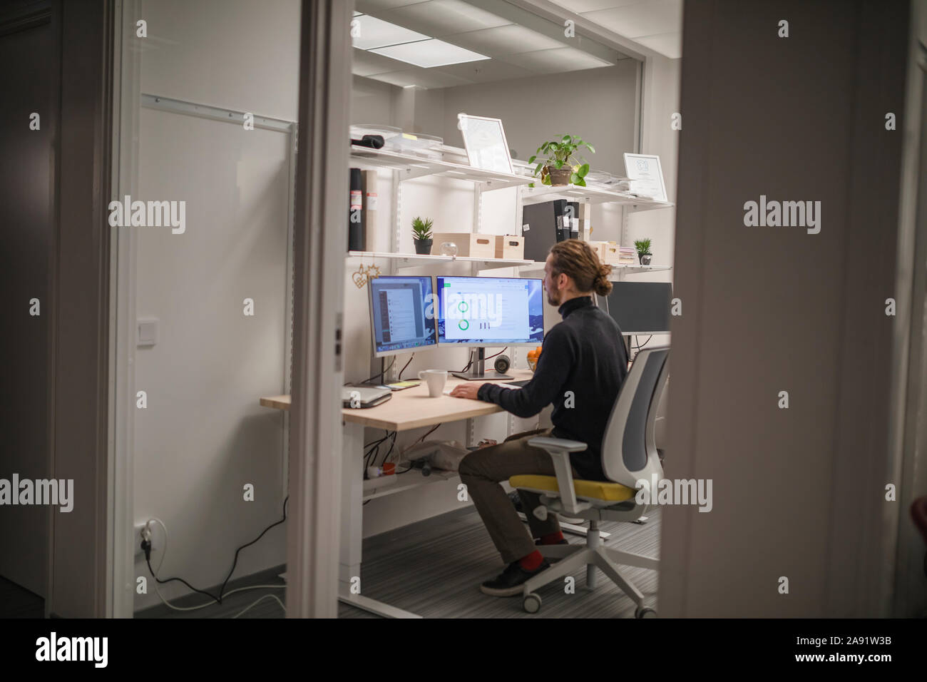 Man using computer in office Stock Photo - Alamy