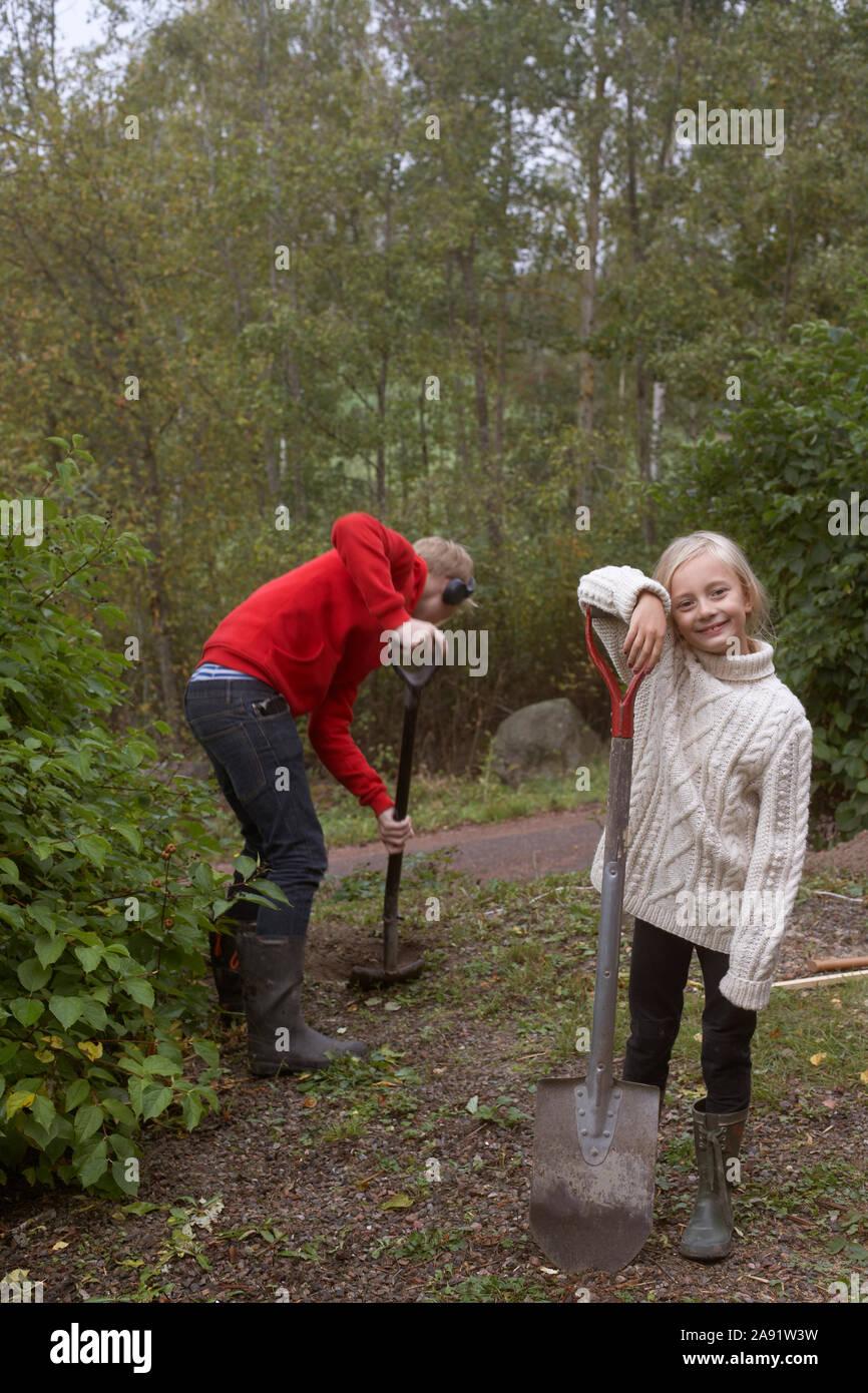 Two boys digging hi-res stock photography and images - Alamy