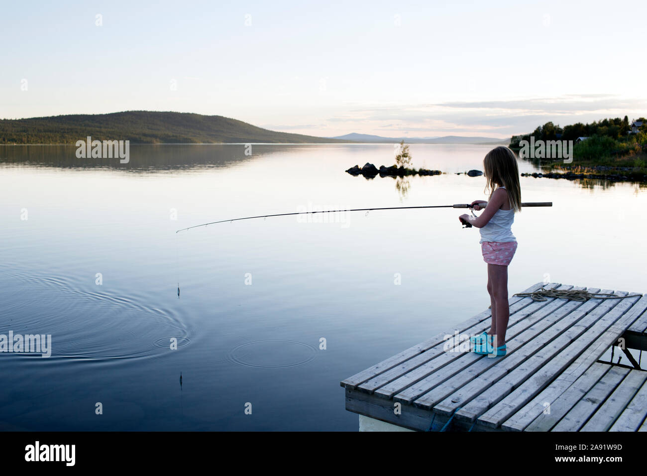 Girl fishing hi-res stock photography and images - Alamy