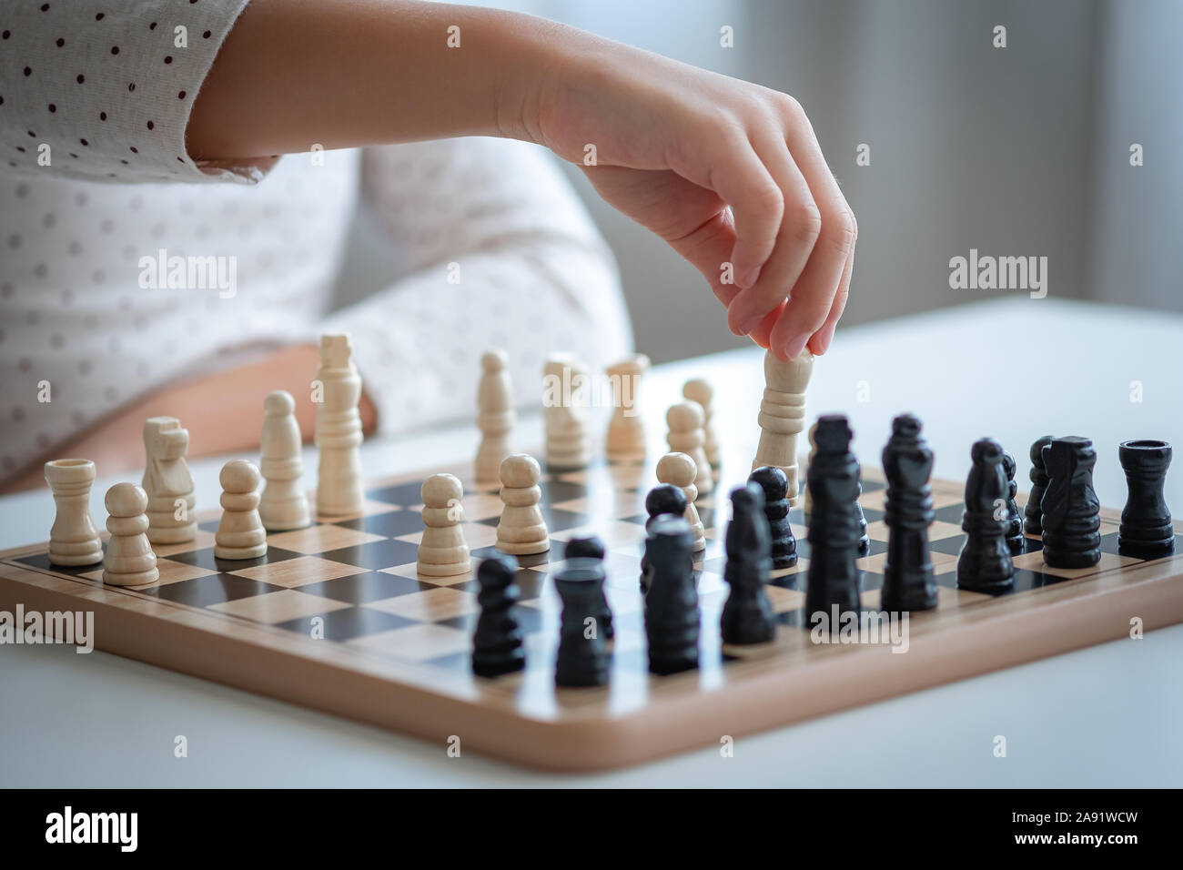 Asian girl playing chess hi-res stock photography and images - Alamy