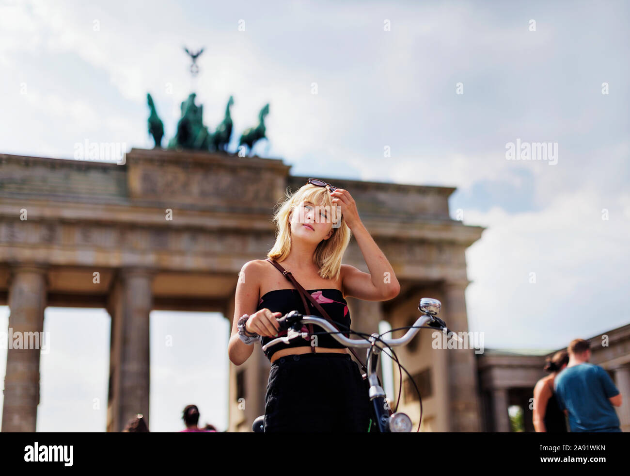 Teenage girl with Brandenburg Gate on background, Berlin, Germany Stock ...
