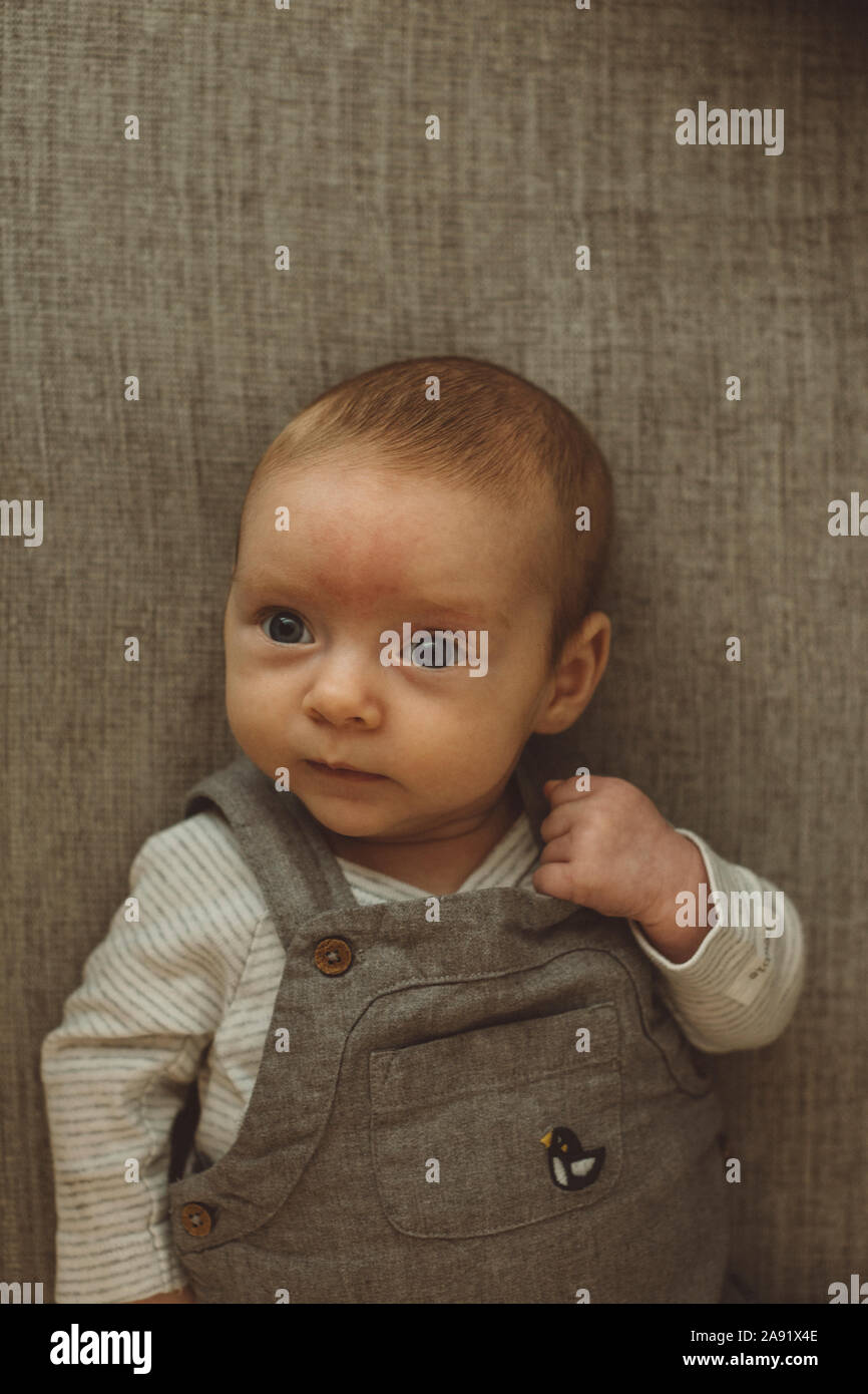 Baby looking at camera Stock Photo - Alamy