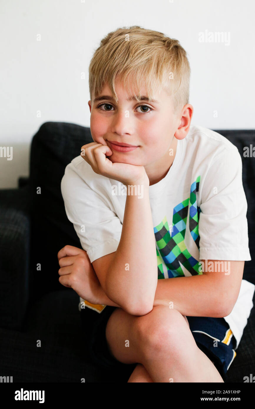 Boy looking at camera Stock Photo - Alamy