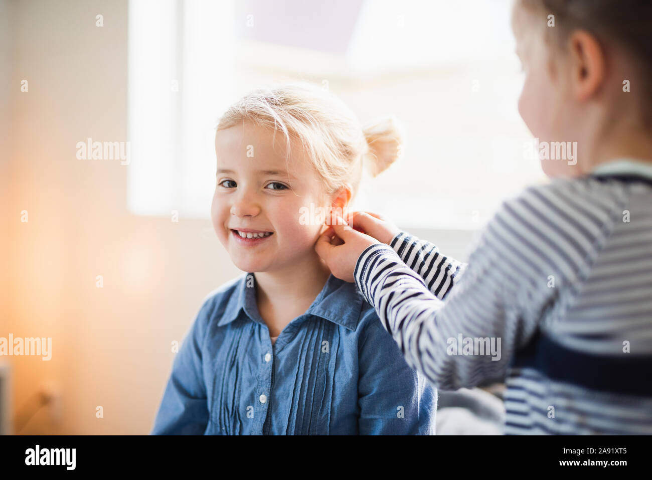 Blonde sisters together hi-res stock photography and images - Alamy