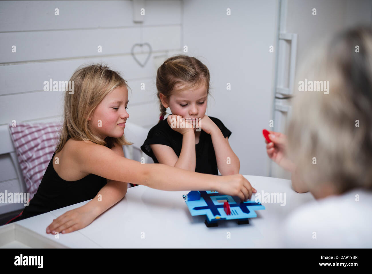 Two girls playing board game hi-res stock photography and images - Alamy