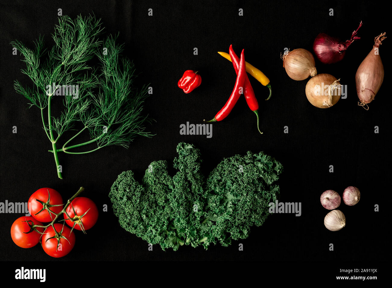Vegetables on black background Stock Photo - Alamy