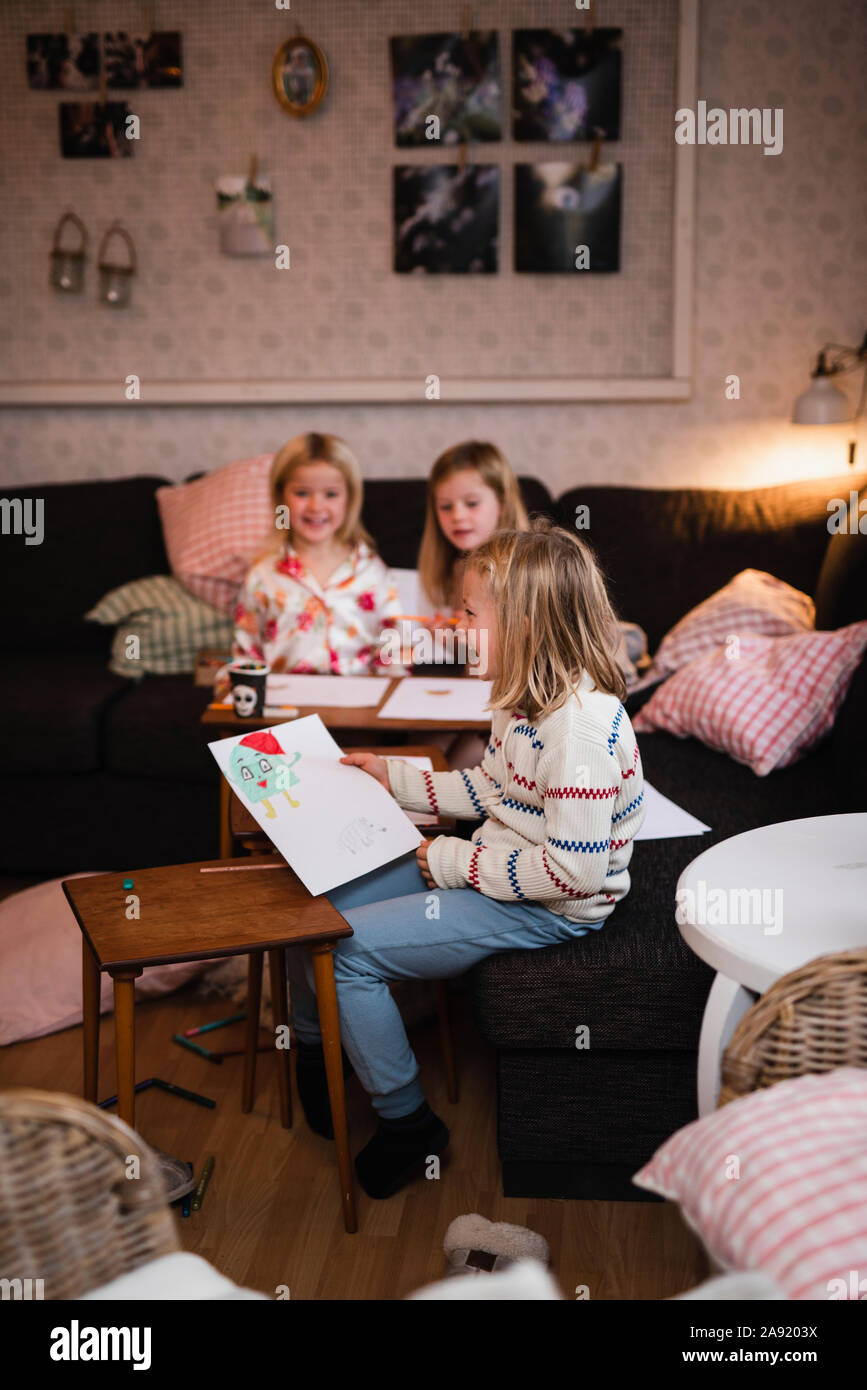 Smiling girls drawing together Stock Photo - Alamy