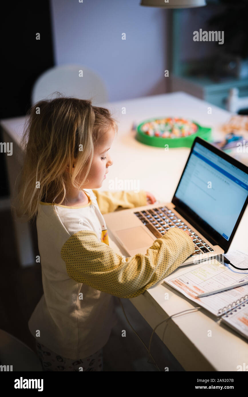 Girl using laptop Stock Photo - Alamy