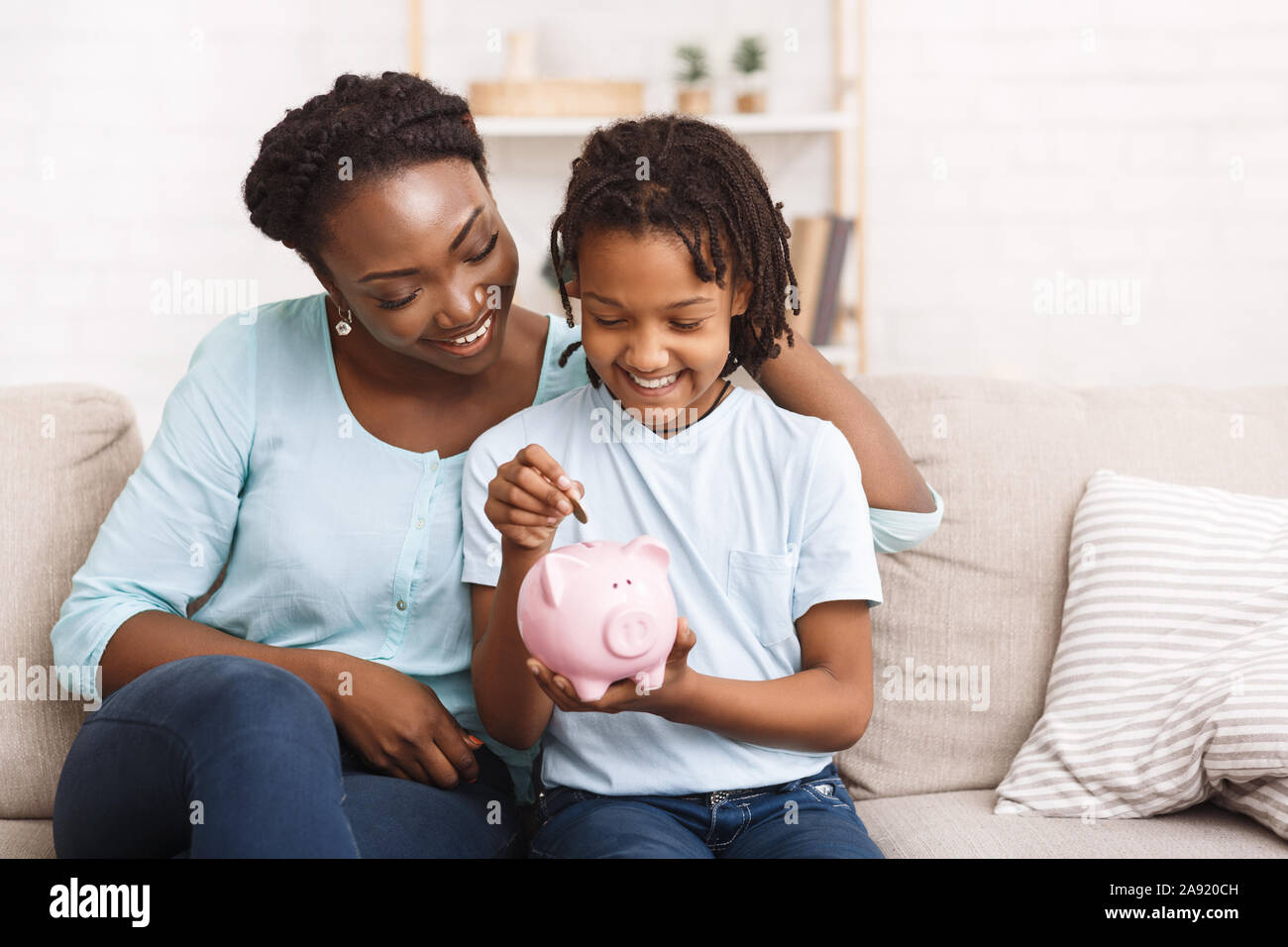 Girl saving money hi-res stock photography and images - Alamy
