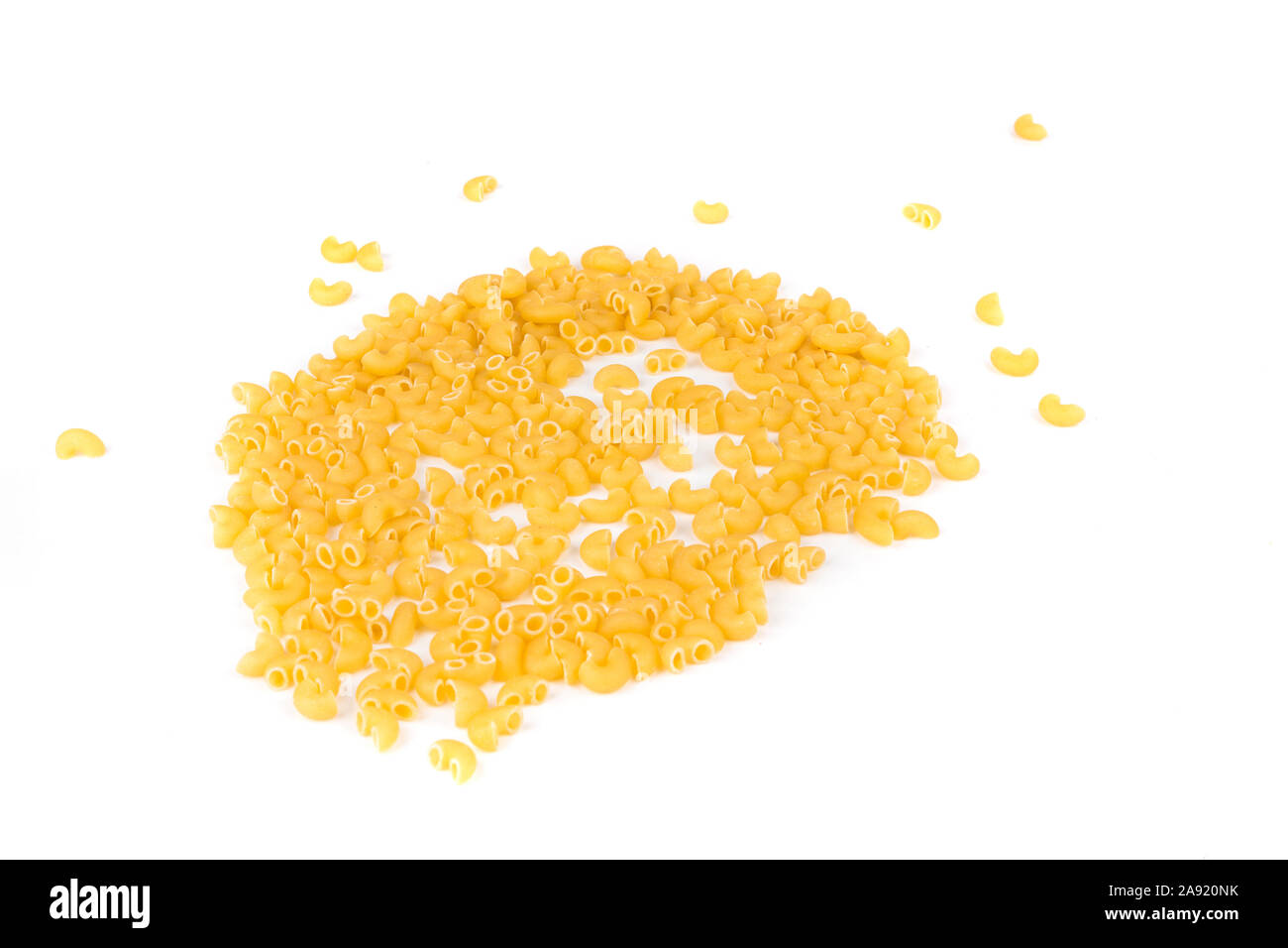 PIle of yellow dried elbow macaroni pasta shapes Stock Photo - Alamy