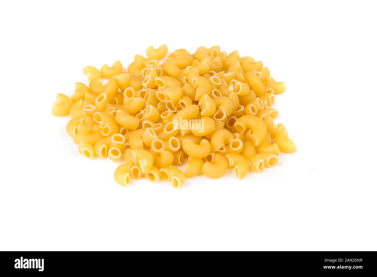 PIle of yellow dried elbow macaroni pasta shapes Stock Photo - Alamy
