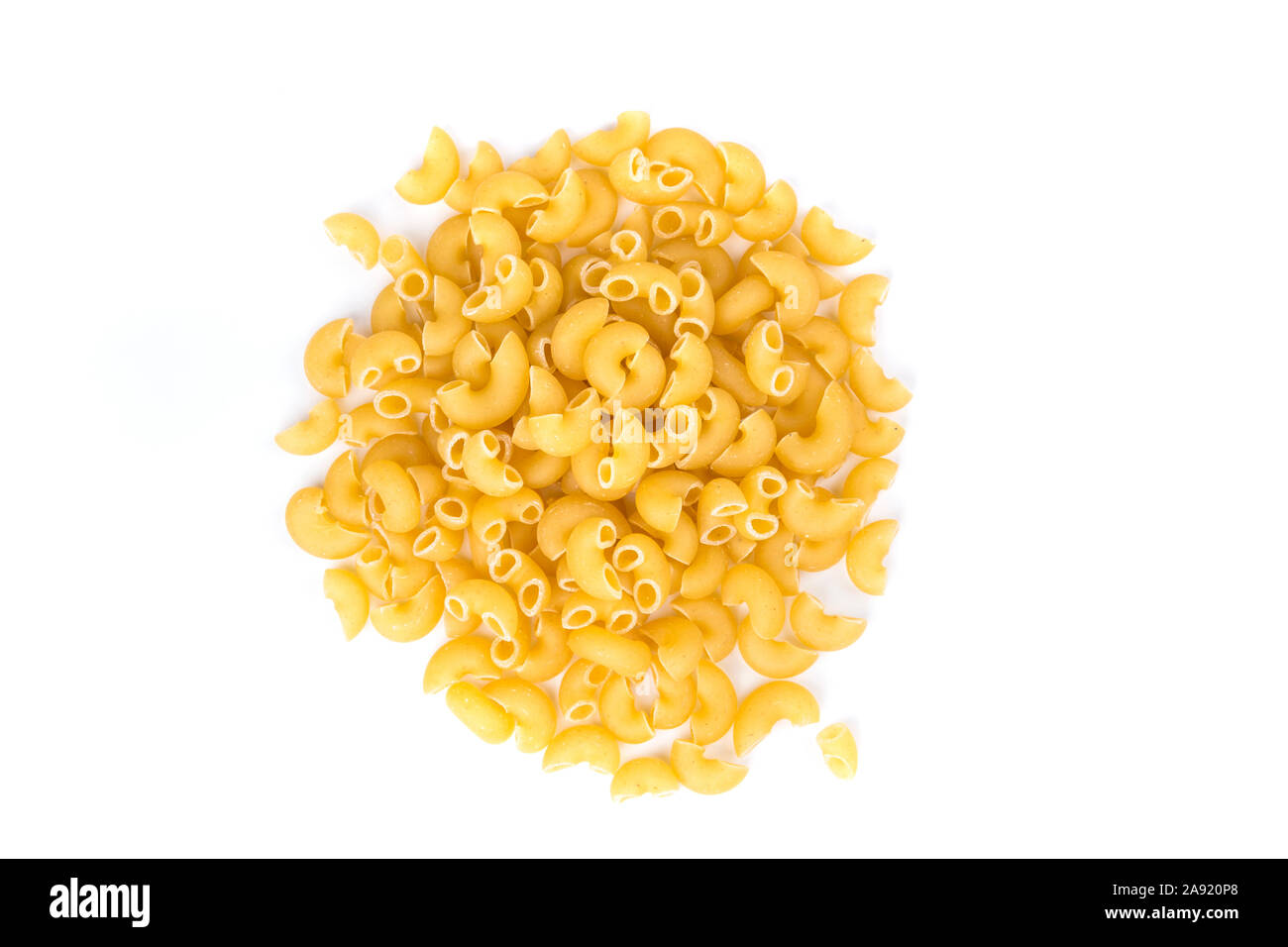 PIle of yellow dried elbow macaroni pasta shapes Stock Photo - Alamy