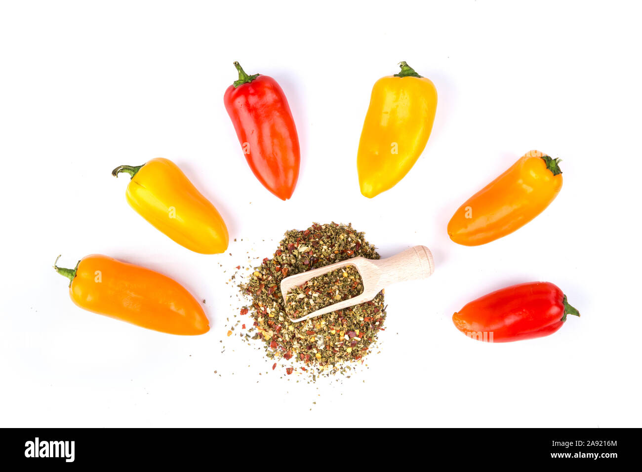 Whole raw red yellow orange spicy chili peppers and menudo seasoning ...