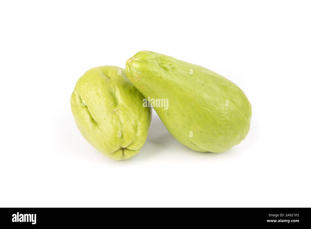 Two raw whole ripe green chayote mexican squash Stock Photo - Alamy