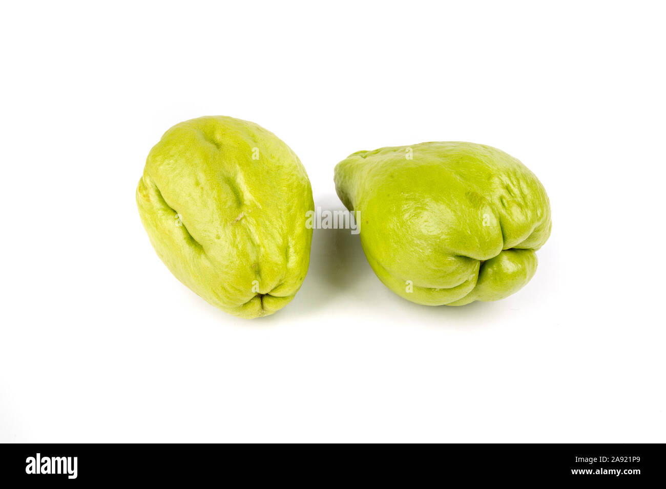 Two raw whole ripe green chayote mexican squash Stock Photo - Alamy