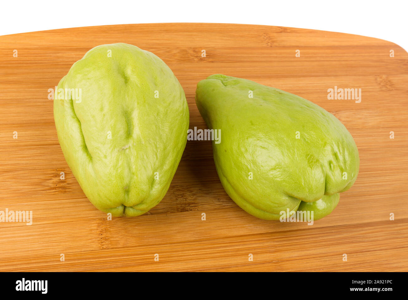 Two raw whole ripe green chayote mexican squash Stock Photo - Alamy