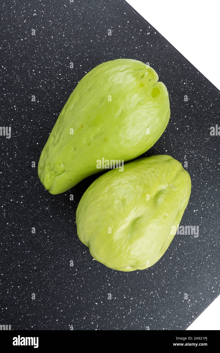 Two raw whole ripe green chayote mexican squash Stock Photo - Alamy