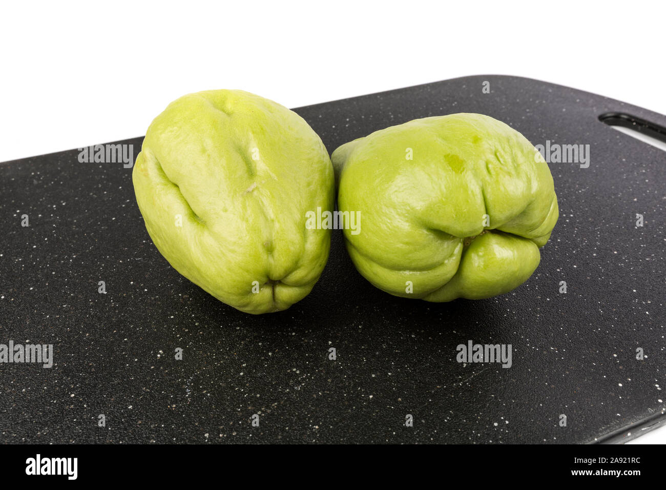 Two raw whole ripe green chayote mexican squash Stock Photo - Alamy