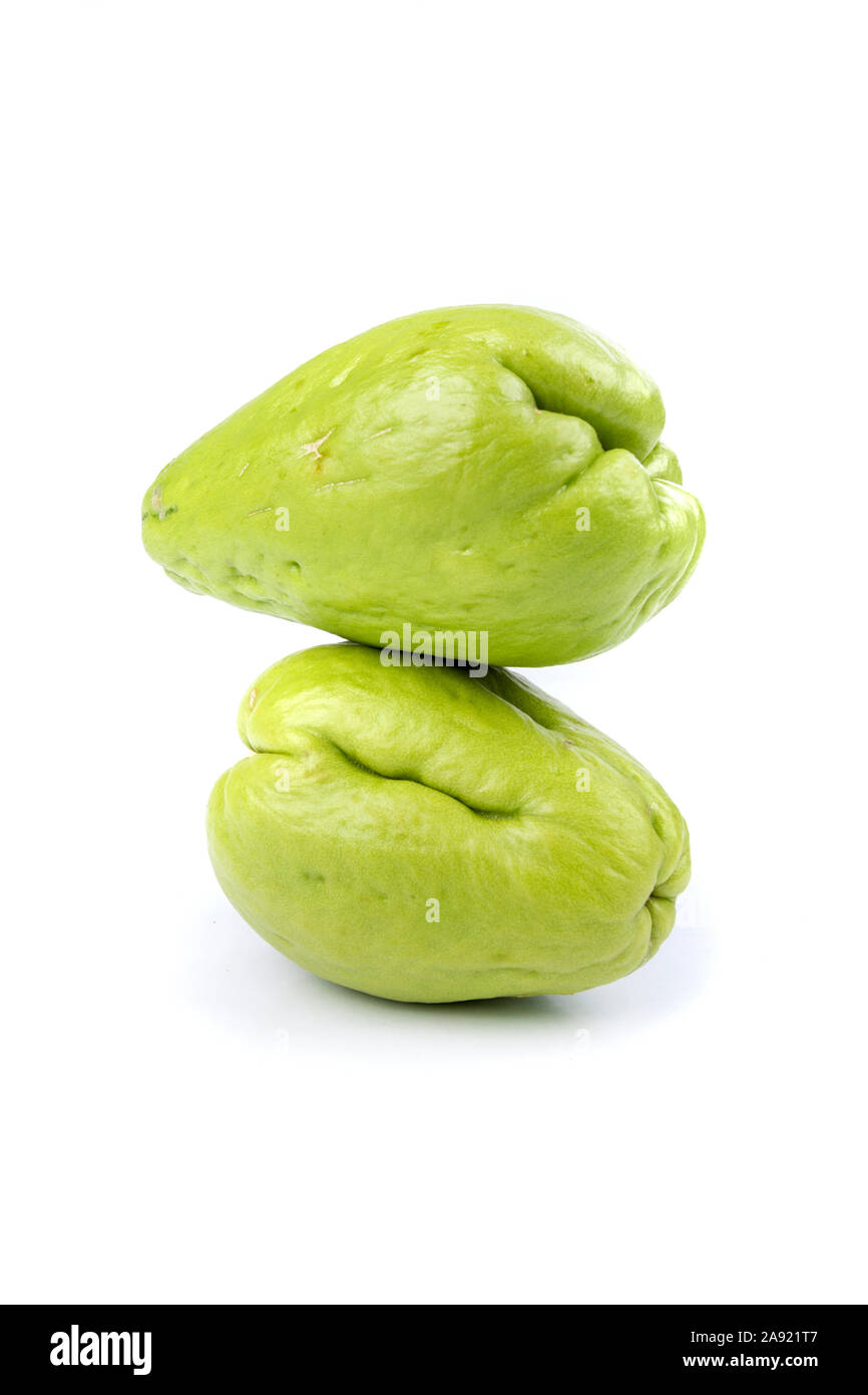 Two raw whole ripe green chayote mexican squash Stock Photo - Alamy