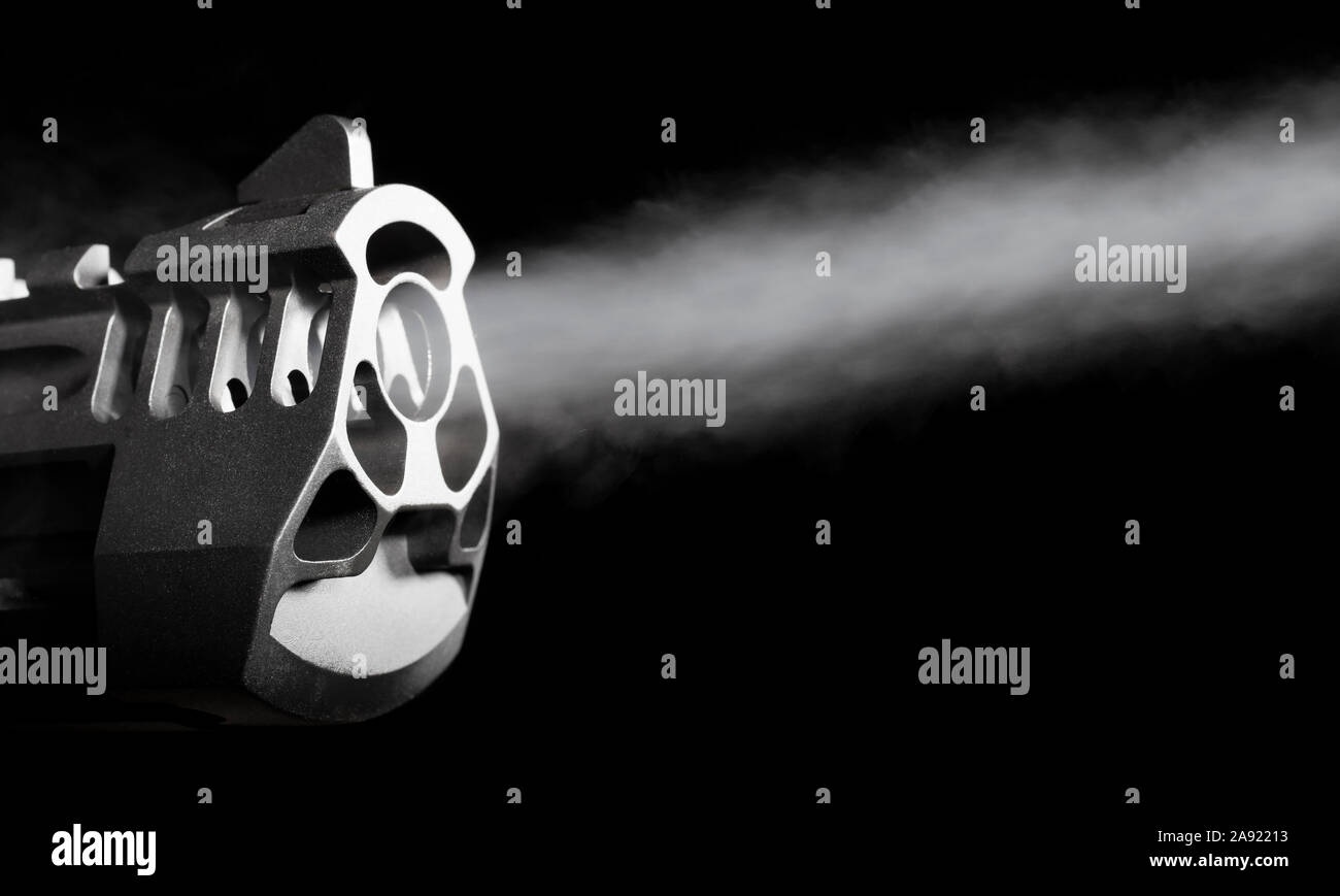 Handgun barrel with smoke coming out on black Stock Photo - Alamy