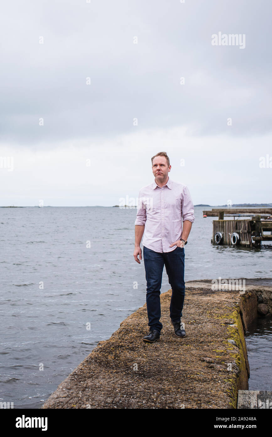 Man on jetty hi-res stock photography and images - Alamy