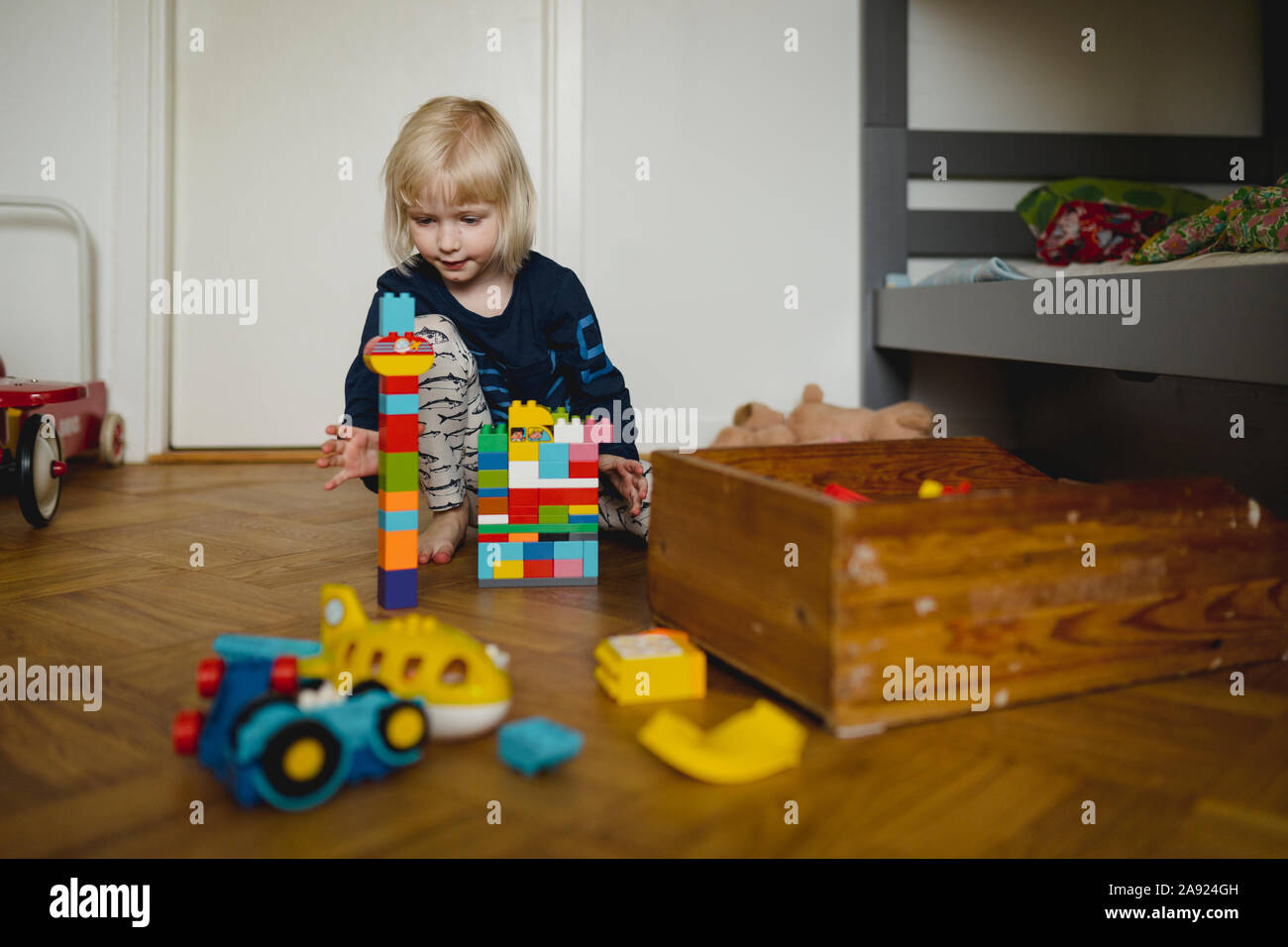 Girl playing building blocks Stock Photo - Alamy