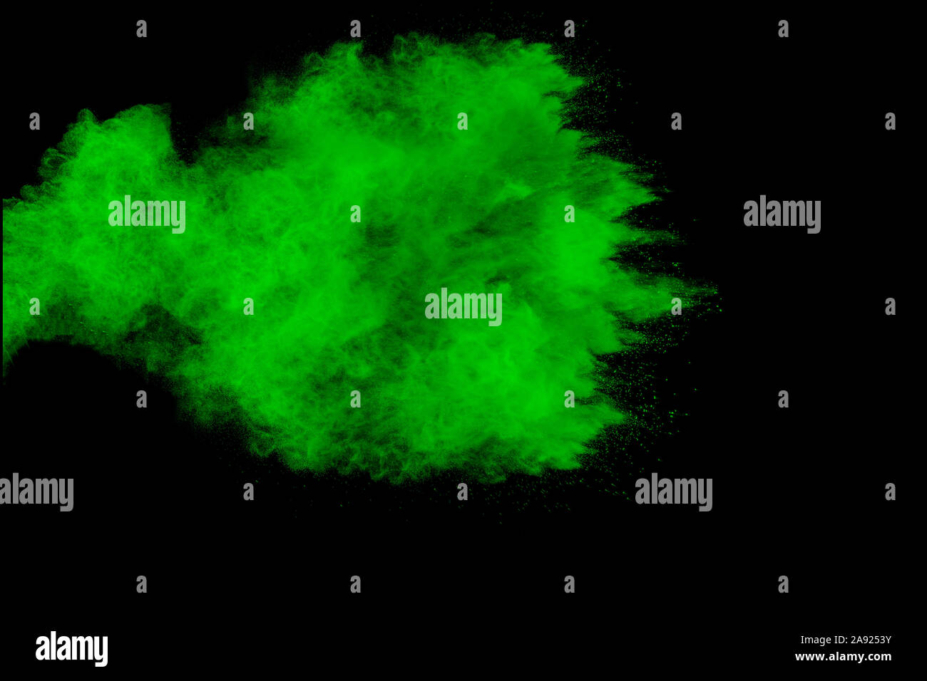 Green powder explosion on black background.Green dust particles splash ...