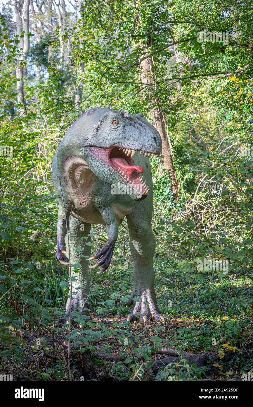 A Model Dinosaur in woodland Stock Photo - Alamy