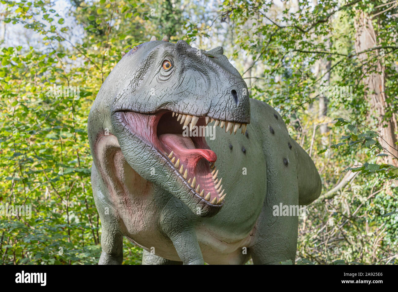 A Model Dinosaur in woodland Stock Photo - Alamy