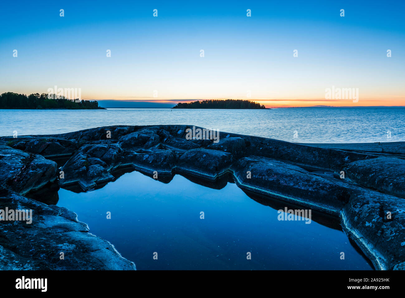 Atmospheric sunset over rocky hi-res stock photography and images - Alamy