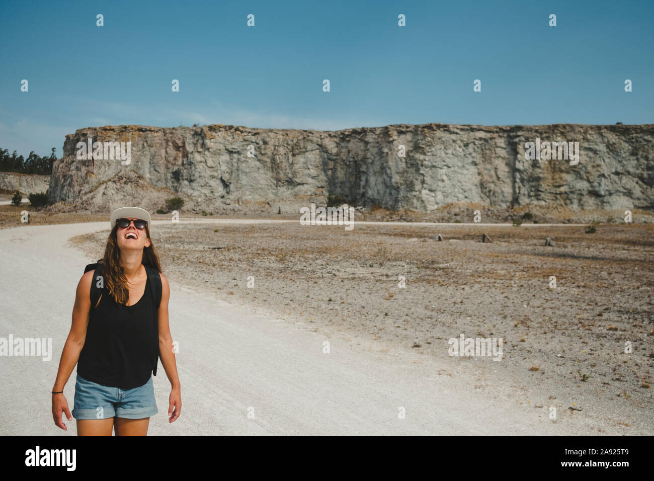 Smiling woman walking Stock Photo - Alamy