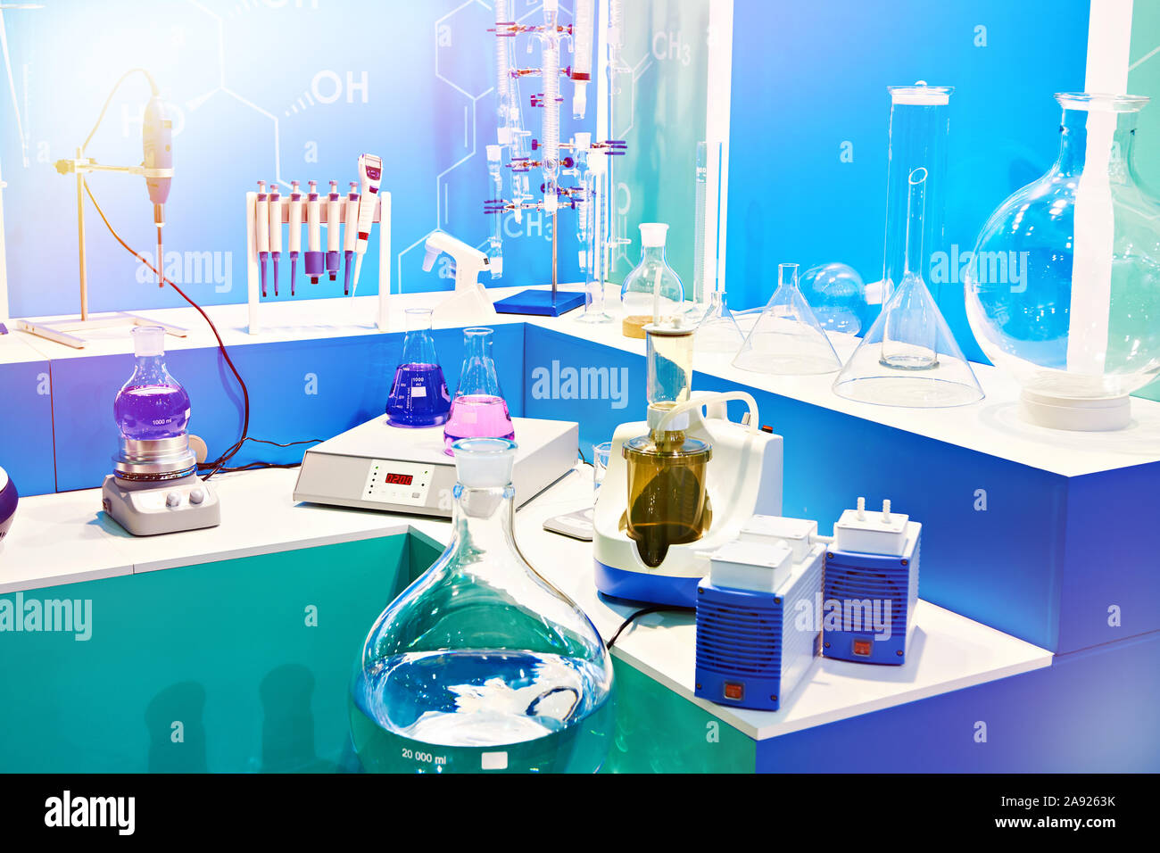 Chemical flasks with liquids and equipment in lab Stock Photo - Alamy