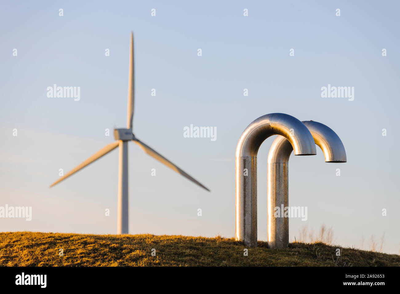 Pipes, wind turbine on background Stock Photo - Alamy