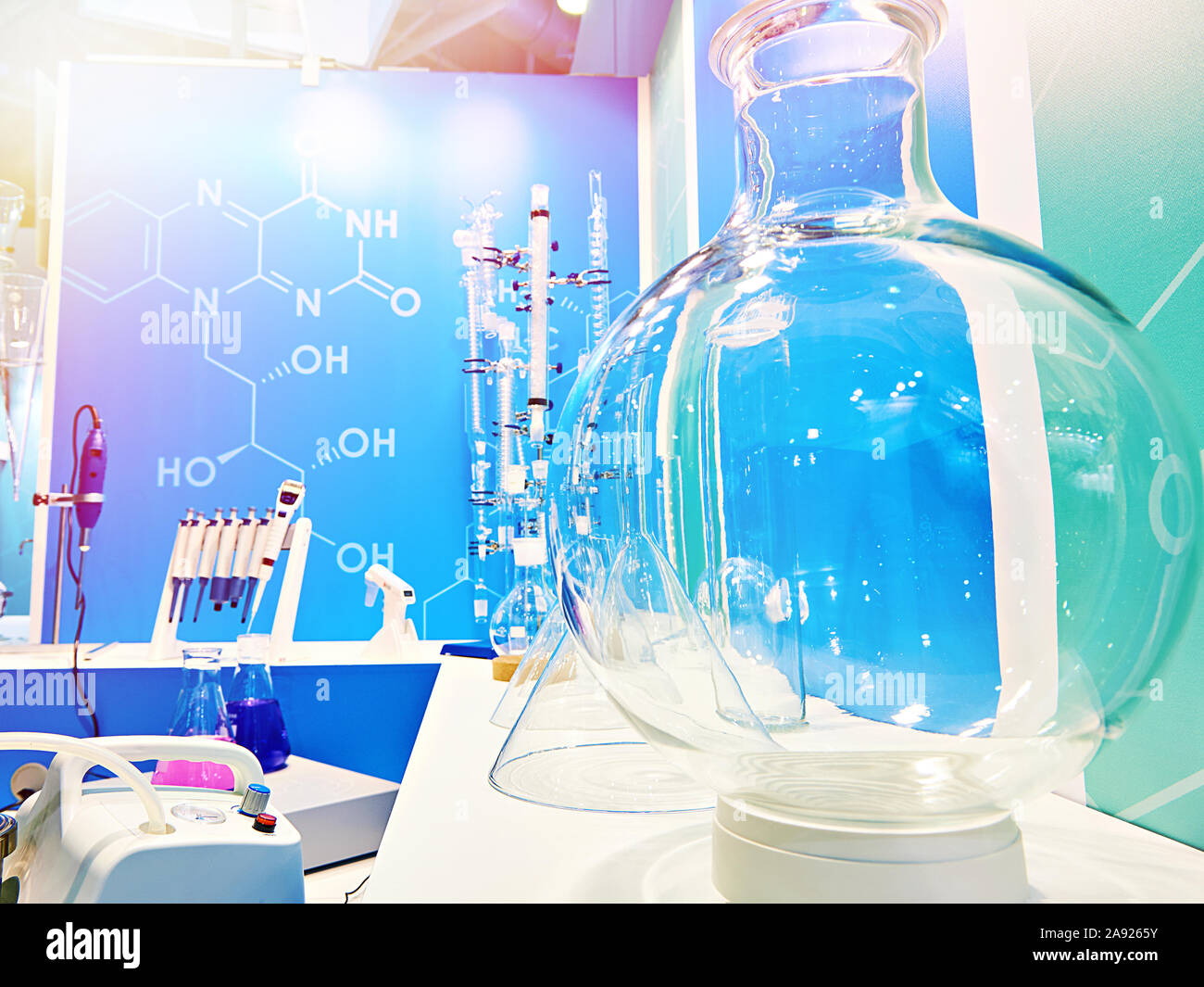 Chemical flasks with liquids and equipment in lab Stock Photo - Alamy