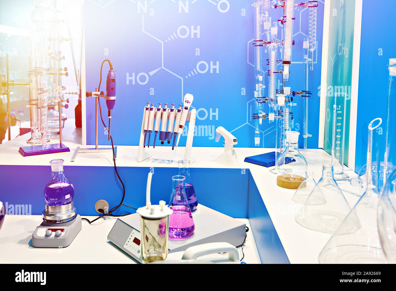 Chemical flasks with liquids and equipment in lab Stock Photo - Alamy
