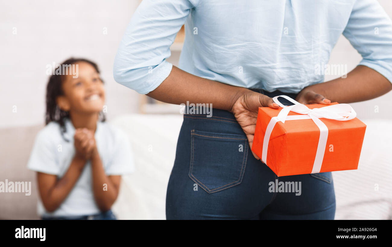 Mother hiding birthday present for daughter, making surprise Stock ...