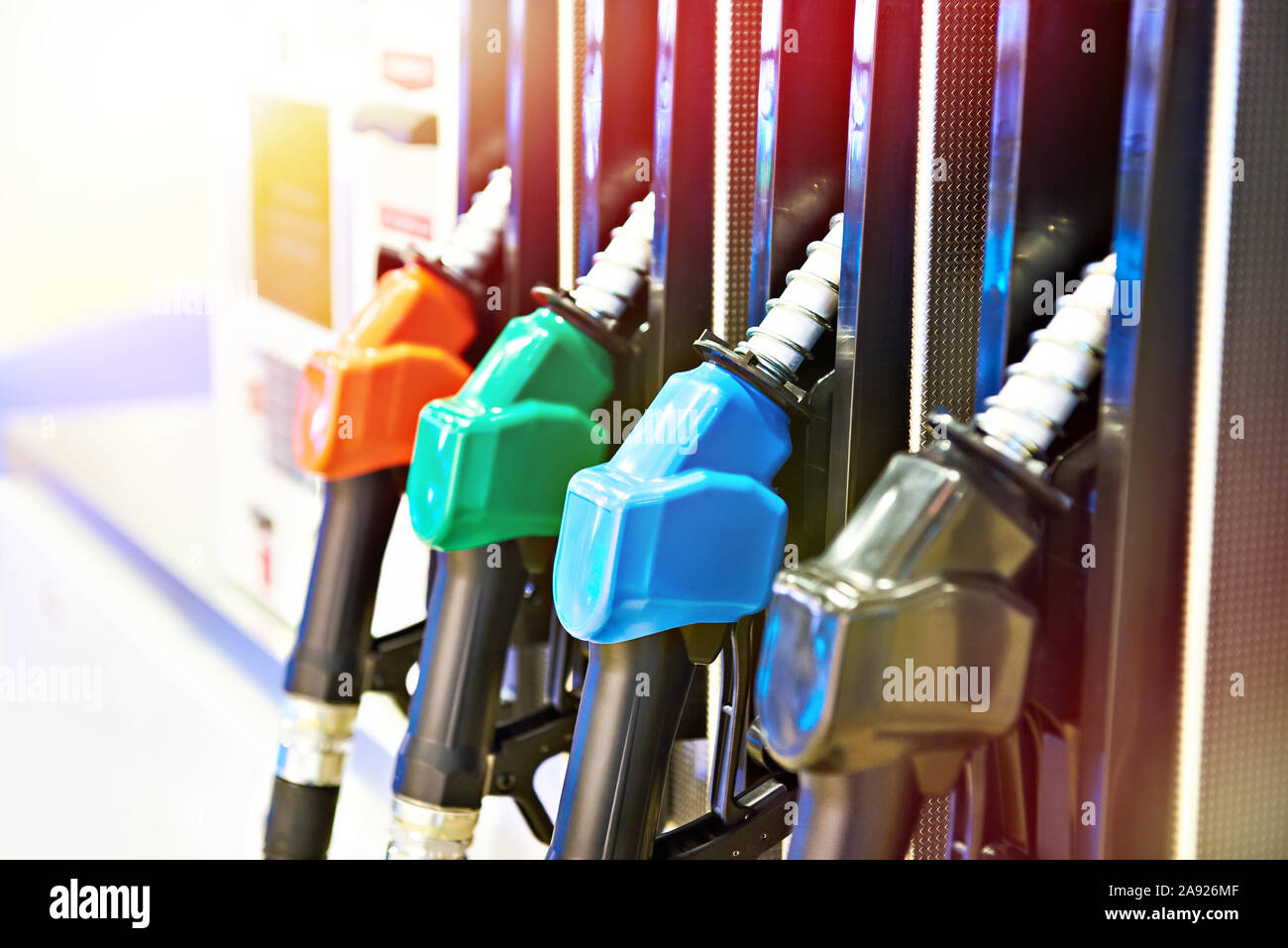 Fuel nozzles on filling station closeup Stock Photo - Alamy